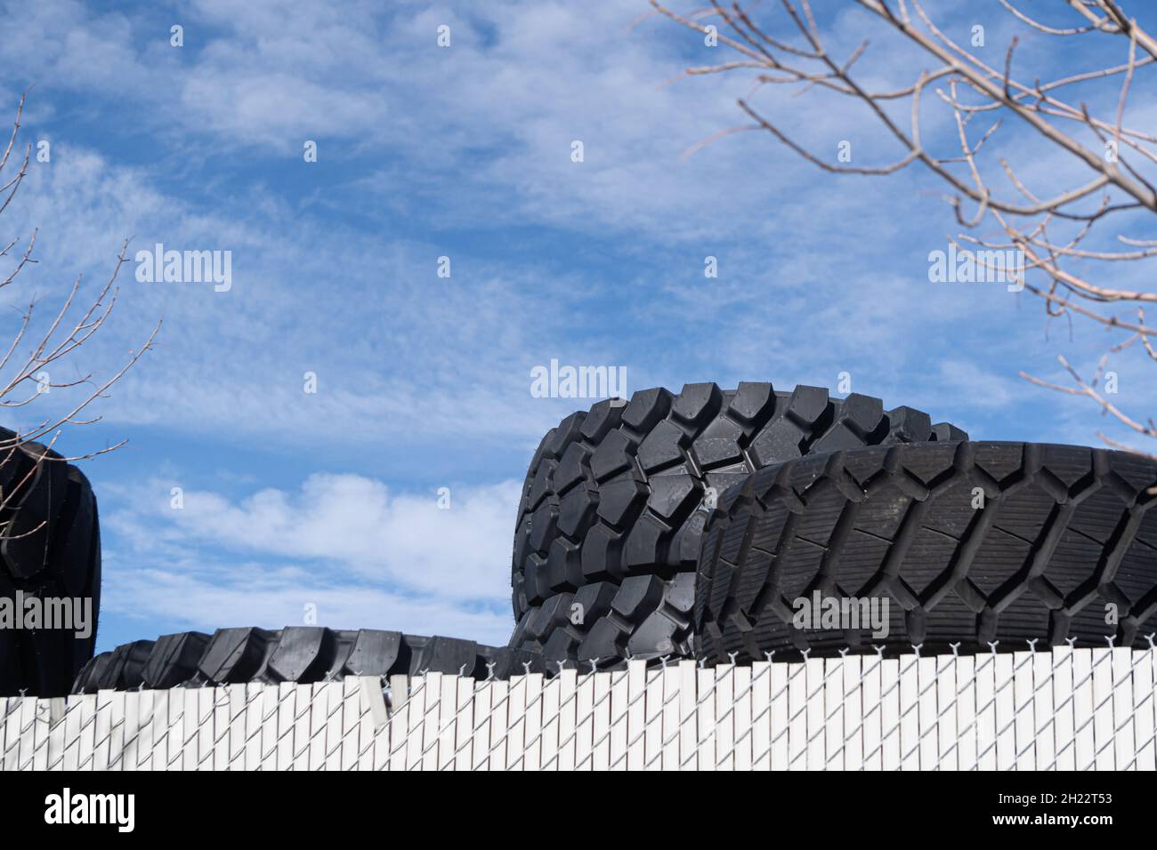 Old tires stacked up together at a car workshop garage Stock Photo - Alamy