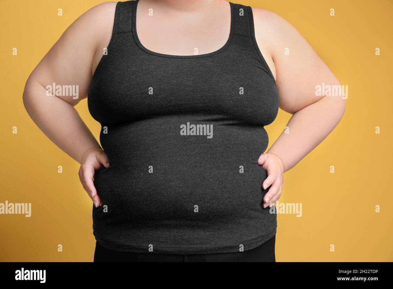 Overweight woman on color background Stock Photo - Alamy