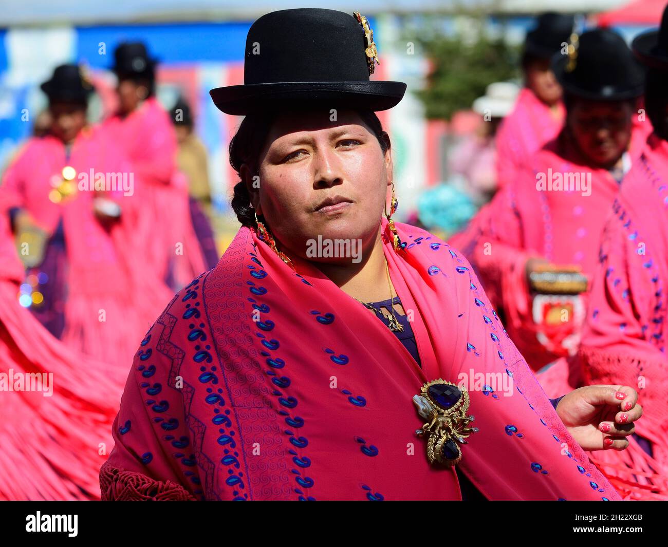 Indigenous woman of a dance group in traditional costumes during a ...