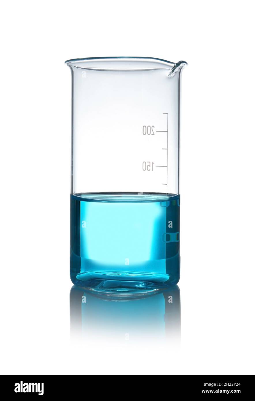 Beaker with liquid on table against white background. Laboratory ...