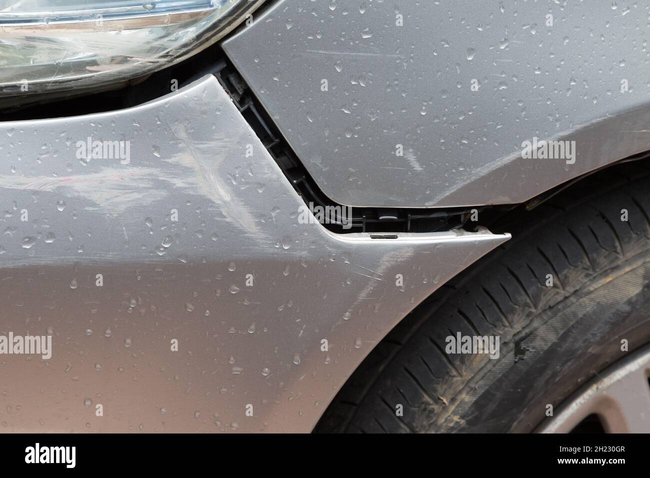 Closeup of crashed car hit on the front bumper off , accident happen on ...