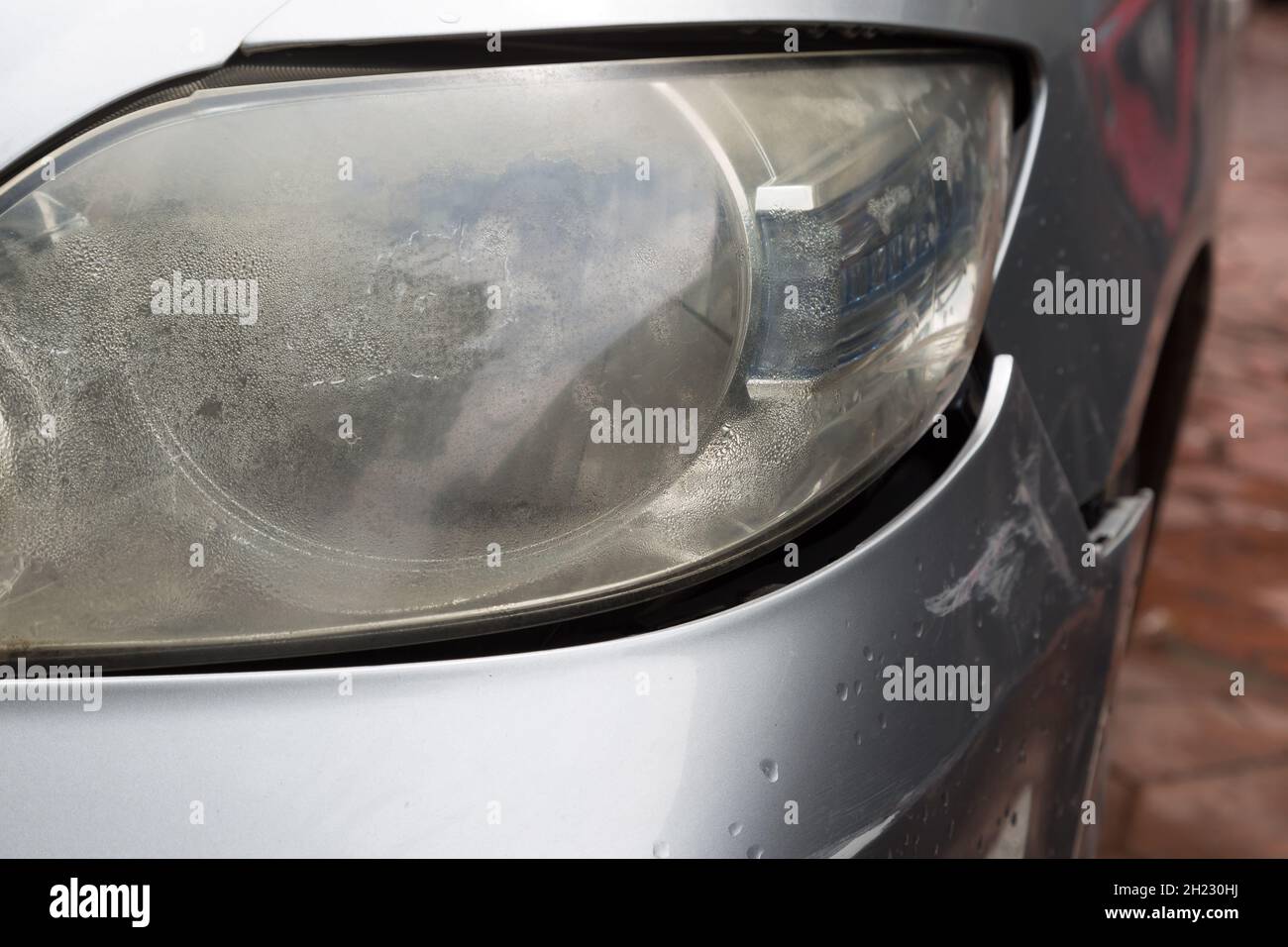 Closeup of crashed car hit on the front bumper off , accident happen on ...