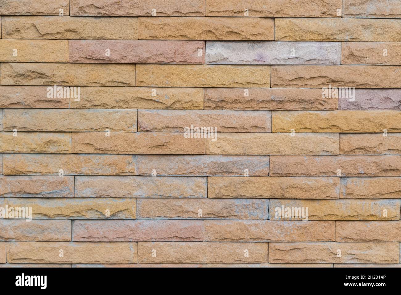 yellow stone wall made with stone blocks use for background Stock Photo ...