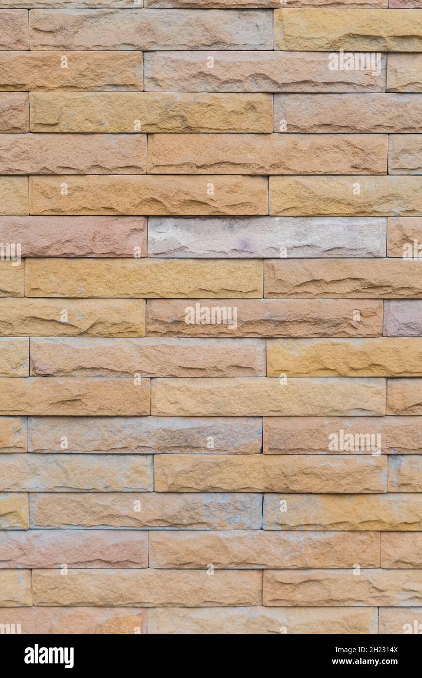 yellow stone wall made with stone blocks use for background Stock Photo ...