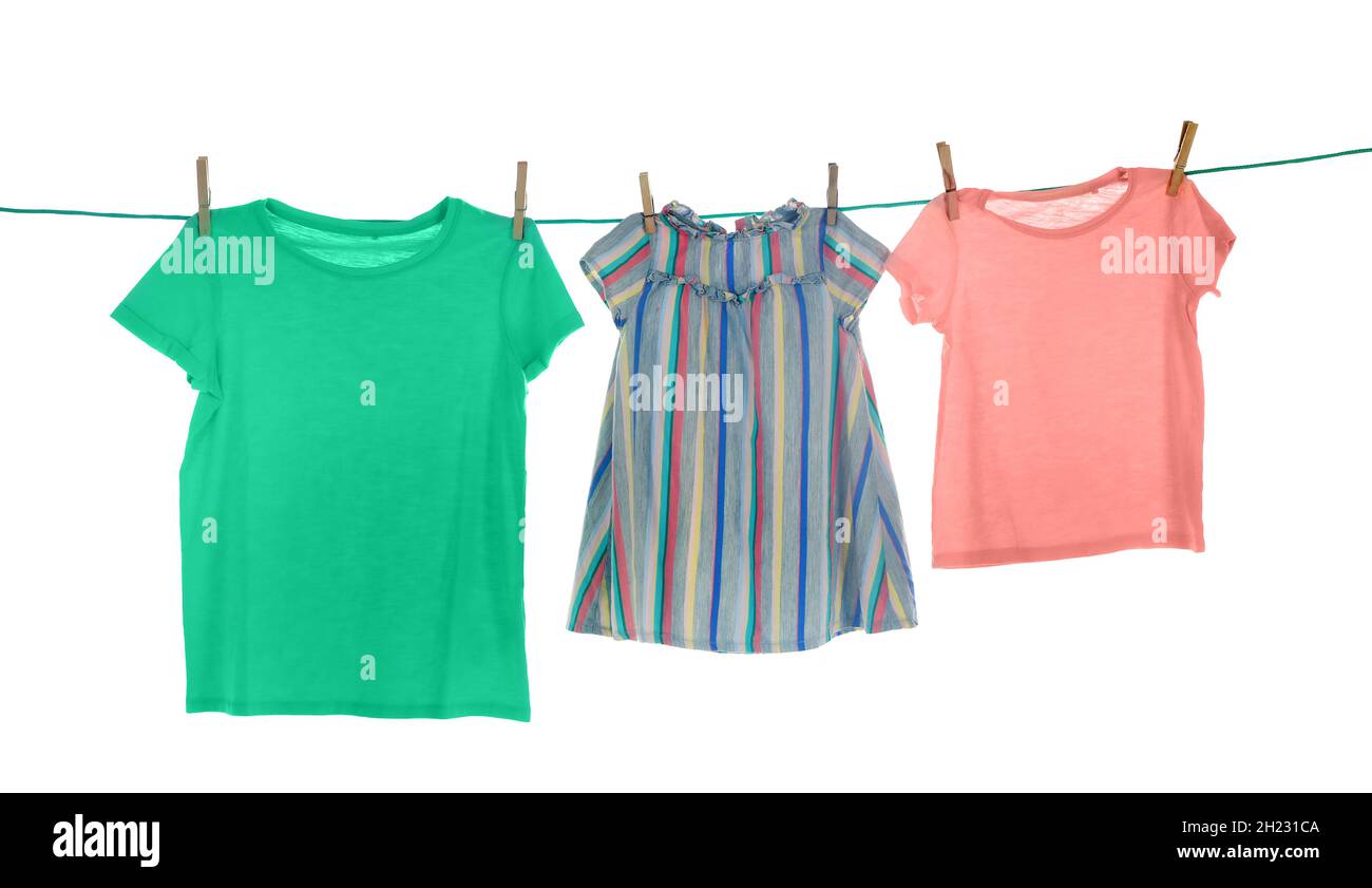 Clothes on laundry line against white background Stock Photo - Alamy