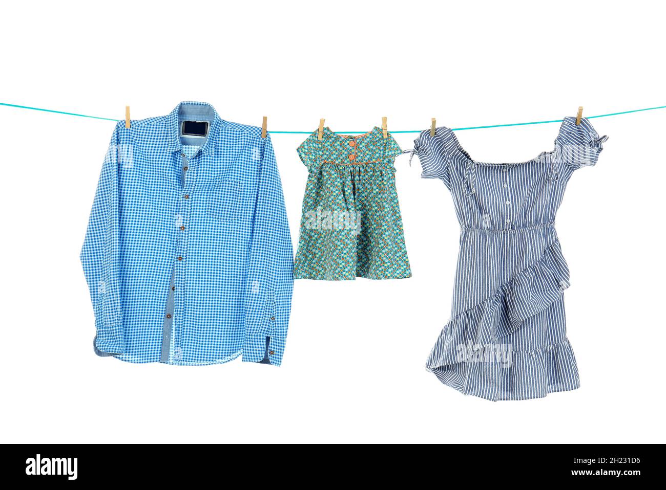 Clothes on laundry line against white background Stock Photo - Alamy