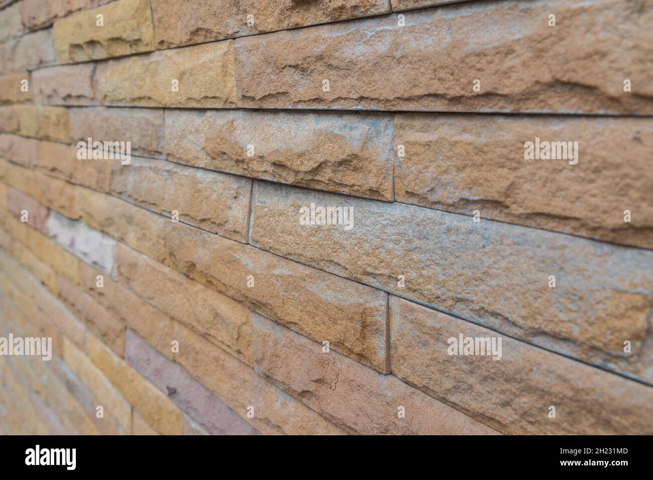 yellow stone wall made with stone blocks use for background Stock Photo ...