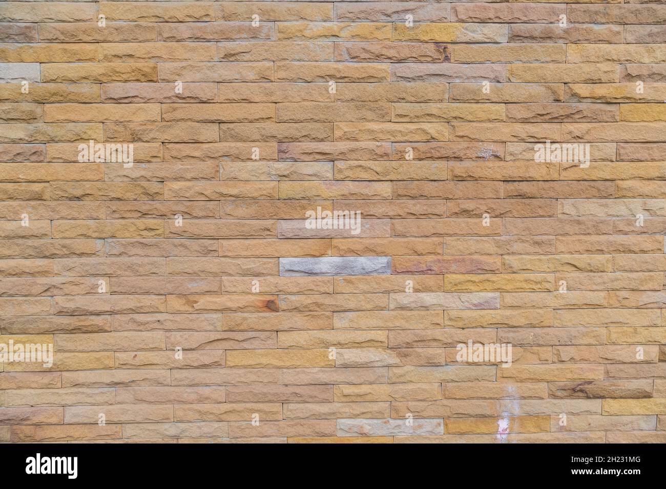 yellow stone wall made with stone blocks use for background Stock Photo ...