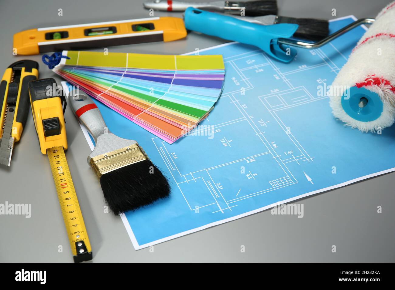 Set of decorator's tools and project drawing on grey background Stock ...