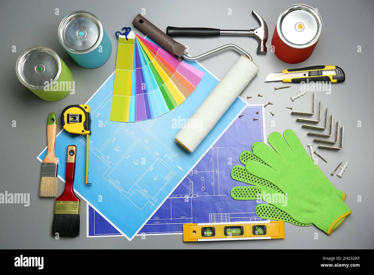Set of decorator's tools and project drawings on grey background Stock ...