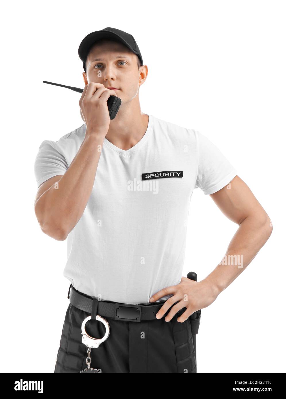 Male security guard using portable radio transmitter on white ...