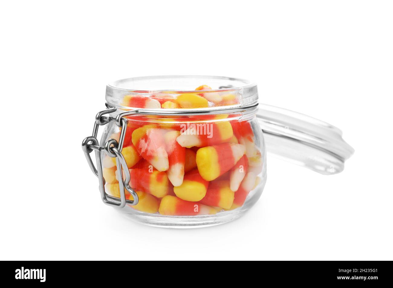 Colorful candy corns in jar on white background Stock Photo - Alamy