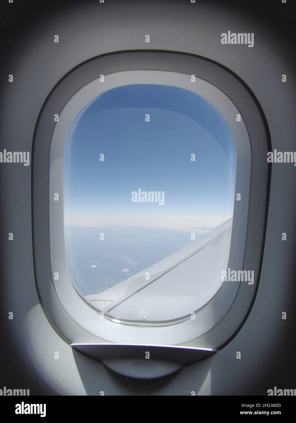 View of an airplane wing from the window of an aircraft in flight Stock ...