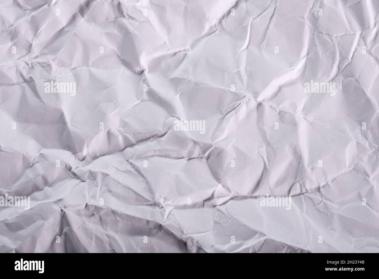 Closeup shot of a white crumpled paper sheet for backgrounds Stock ...