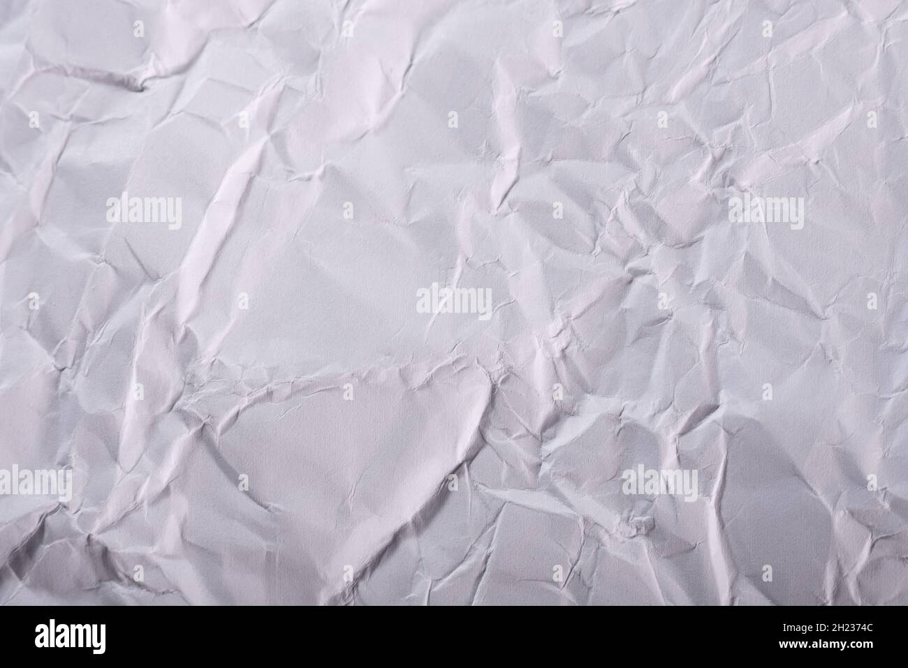 Closeup shot of a white crumpled paper sheet for backgrounds Stock ...