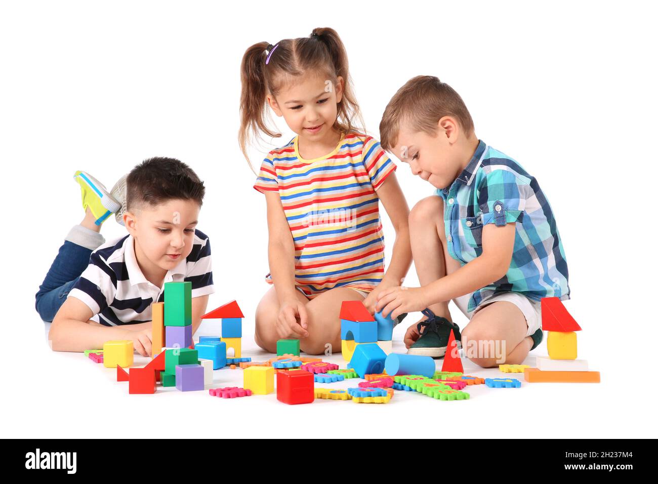 Little children playing together on white background. Indoor ...