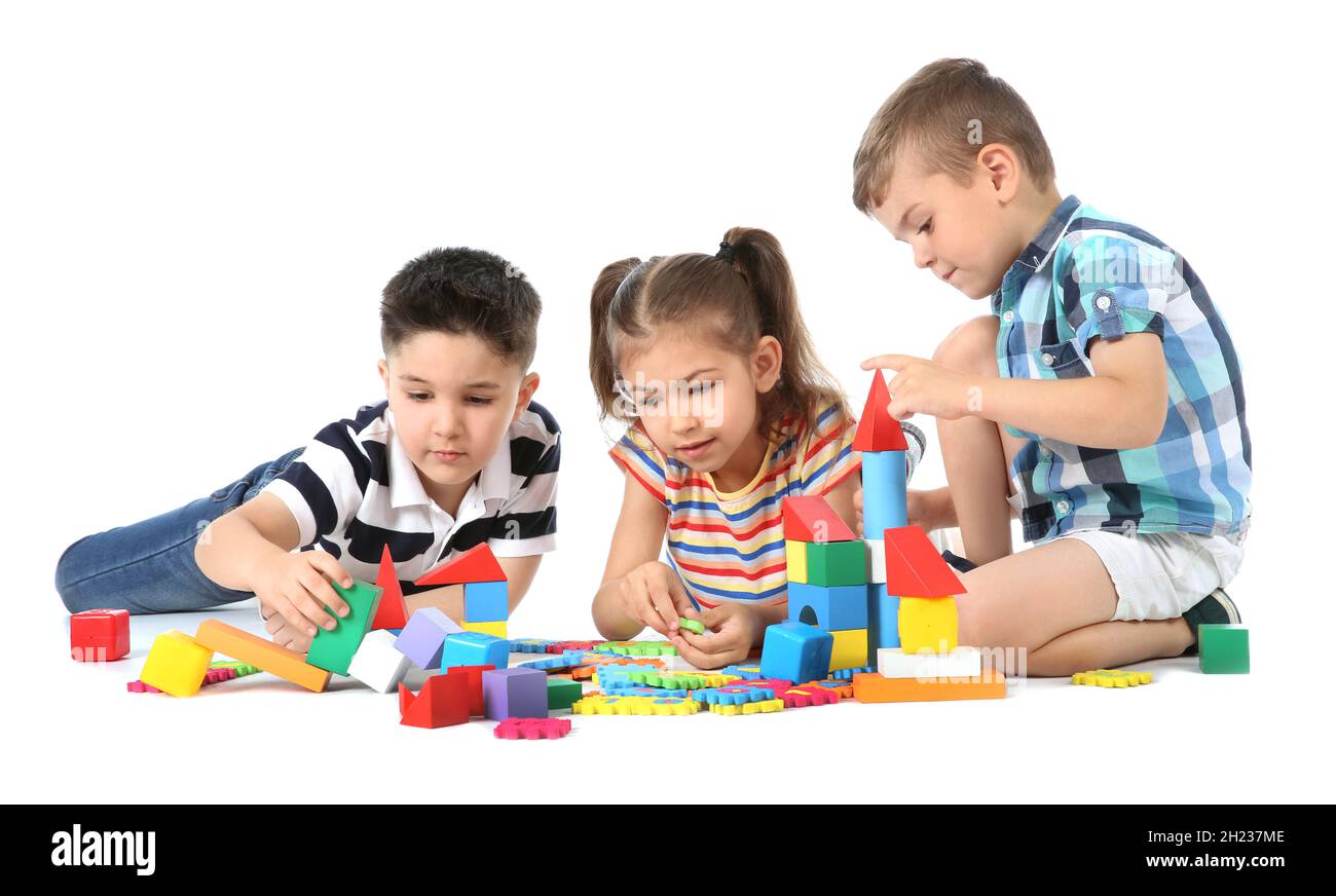 Little children playing together on white background. Indoor ...