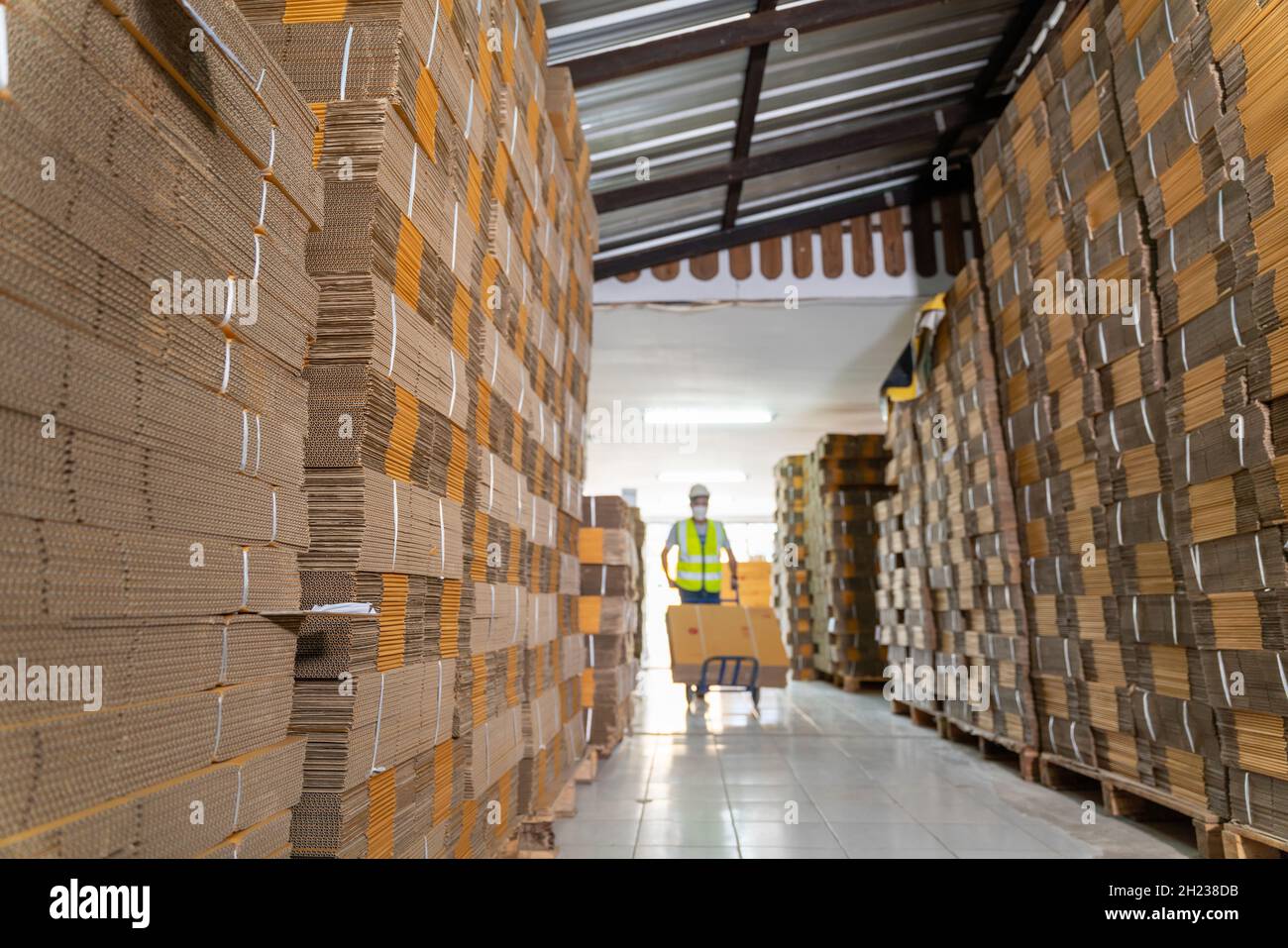Select focus of Row of brown boxes, Warehouse workers characters ...