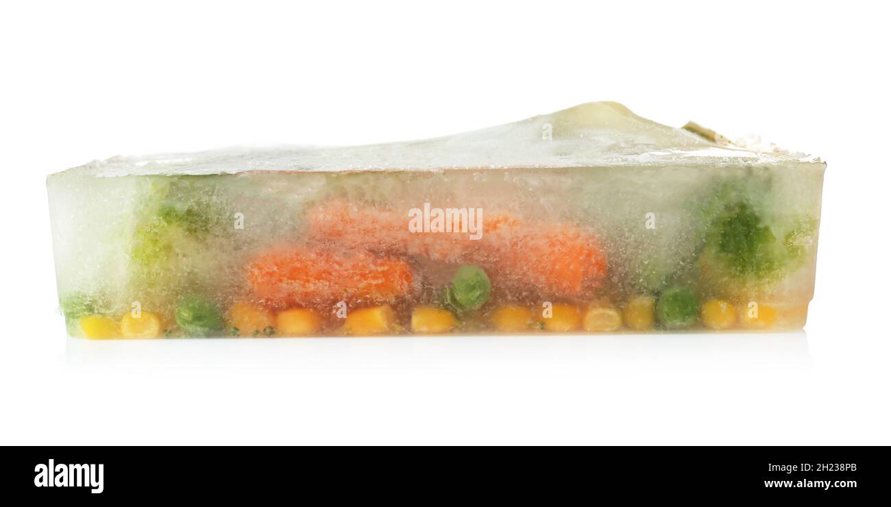 Fresh vegetables frozen in ice cube on white background Stock Photo - Alamy