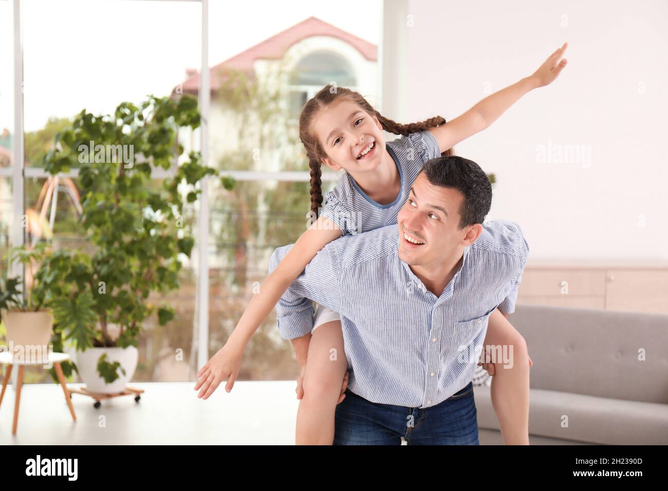 Father with cute child at home. Happy family Stock Photo - Alamy
