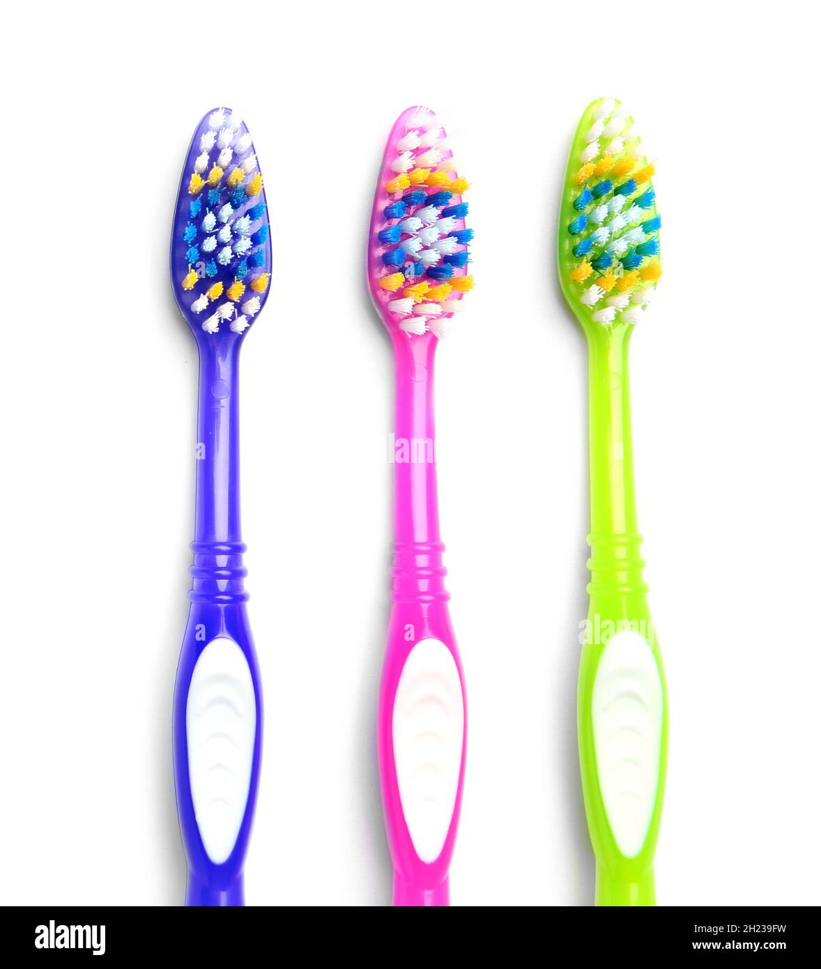 Color toothbrushes on white background. Dental care Stock Photo - Alamy