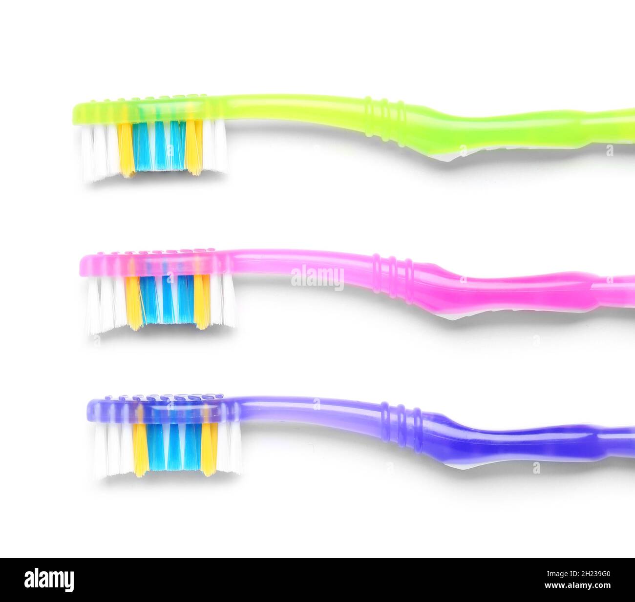 Color toothbrushes on white background. Dental care Stock Photo - Alamy