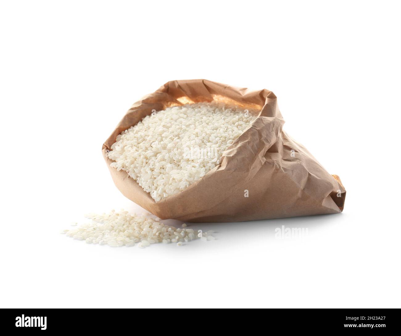 Paper bag with raw rice on white background. Healthy grains and cereals ...