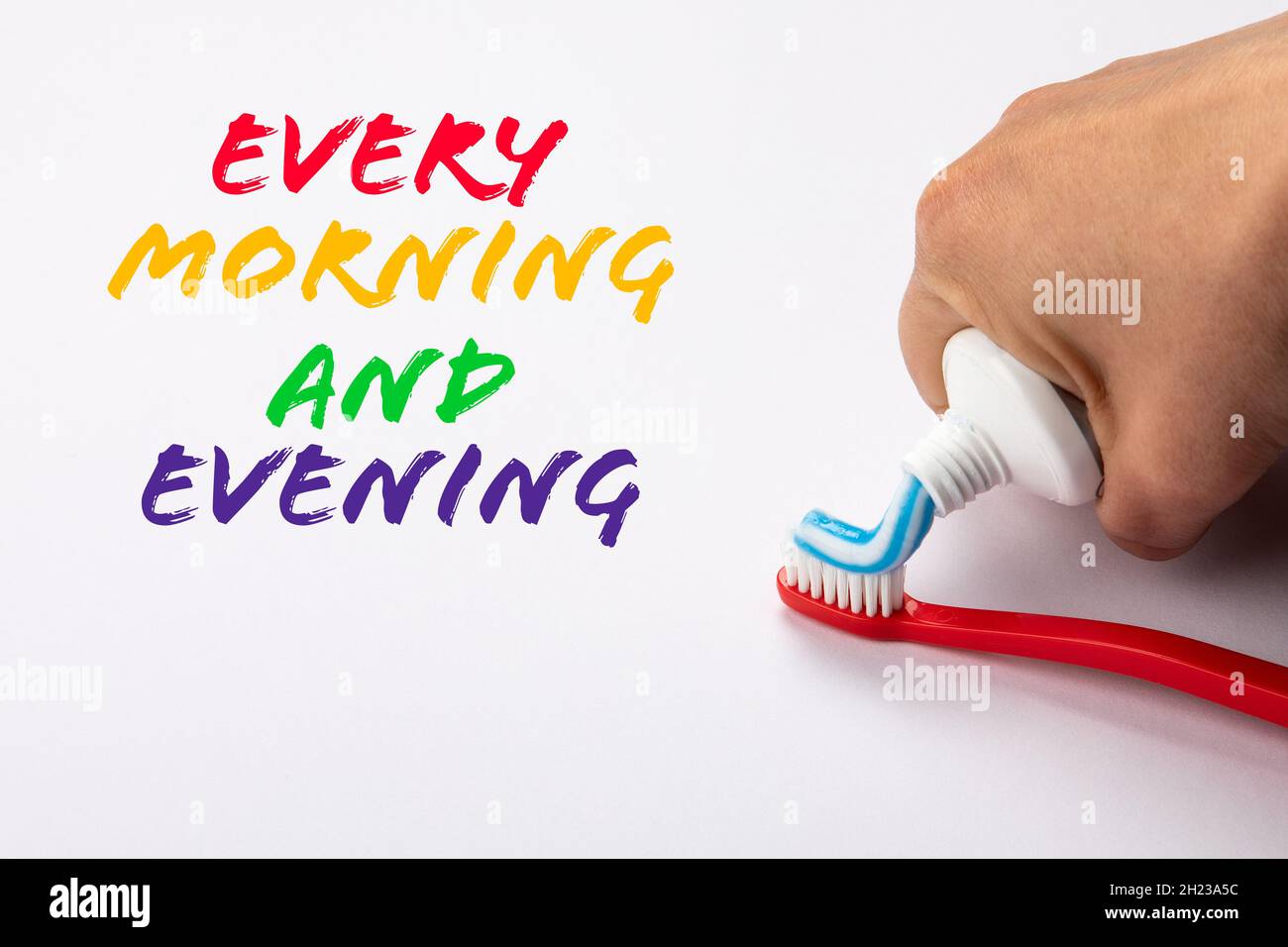Every Morning and Evening. Red toothbrush with toothpaste Stock Photo ...