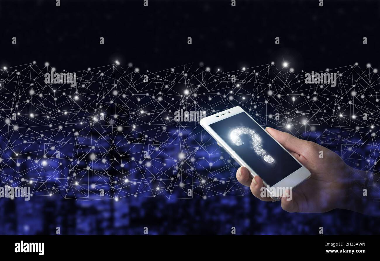 FAQ frequently asked questions concept. Hand hold white smartphone with ... FAQ frequently asked questions concept. Hand hold white smartphone with ...