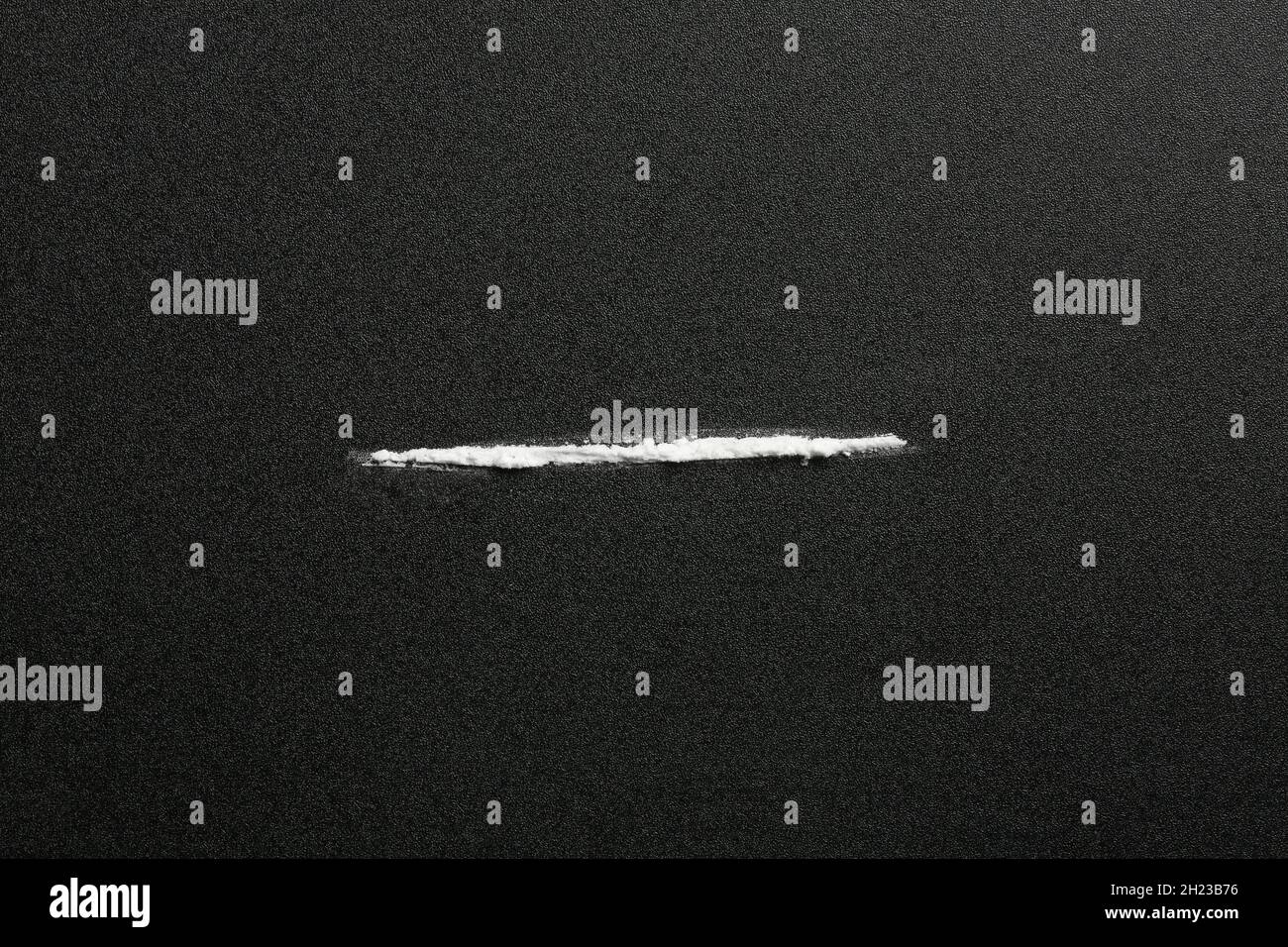 Line of cocaine on dark background, top view Stock Photo - Alamy