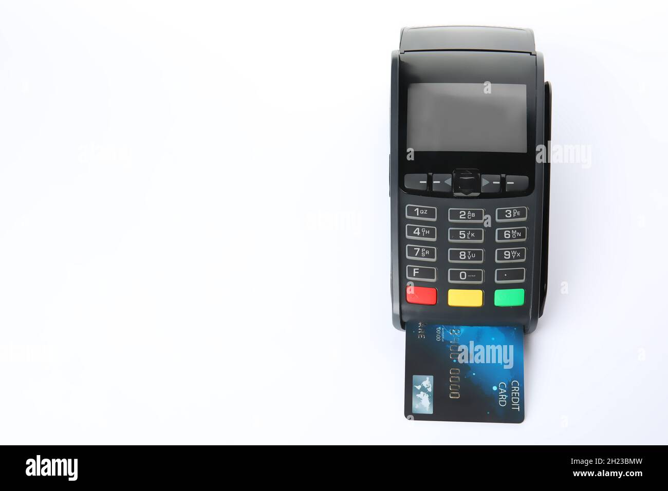 Modern payment terminal with credit card on white background, top view ...