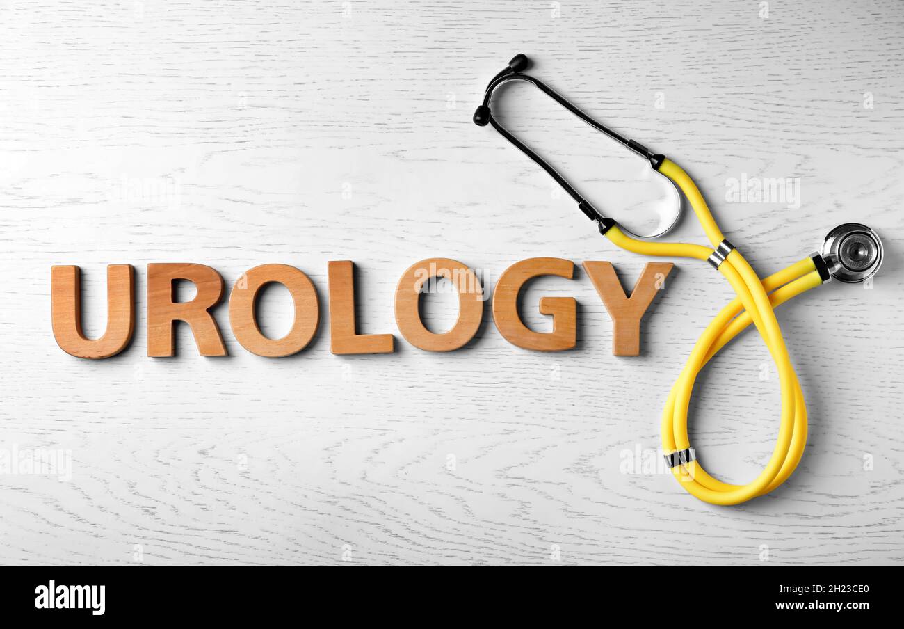 Word "UROLOGY" made with letters and stethoscope on wooden background ...