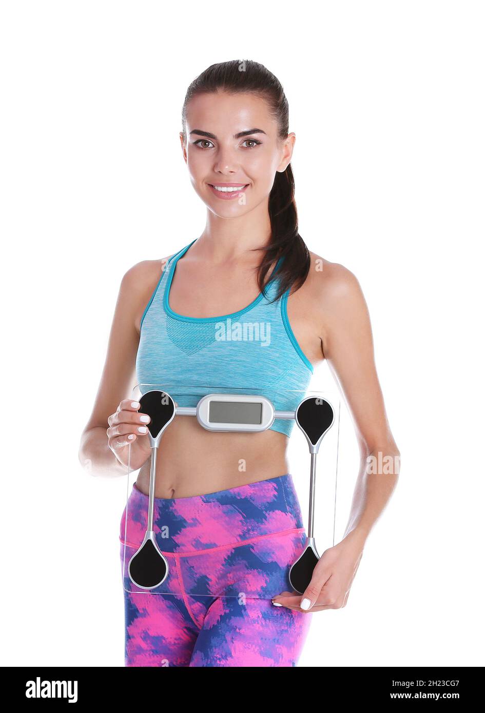 Happy young woman with scales on white background. Weight loss ...