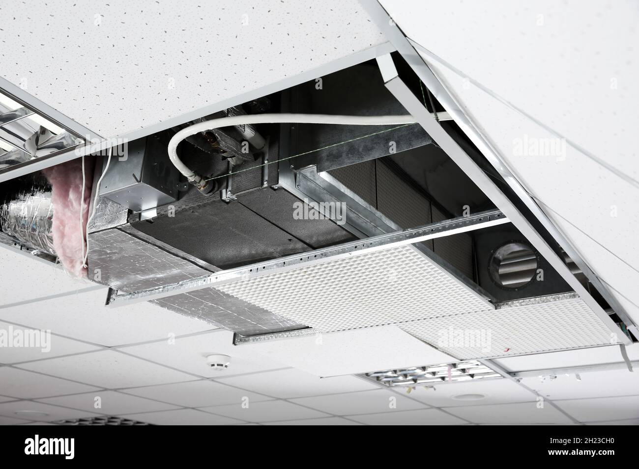 Modern air conditioner on ceiling indoors Stock Photo - Alamy