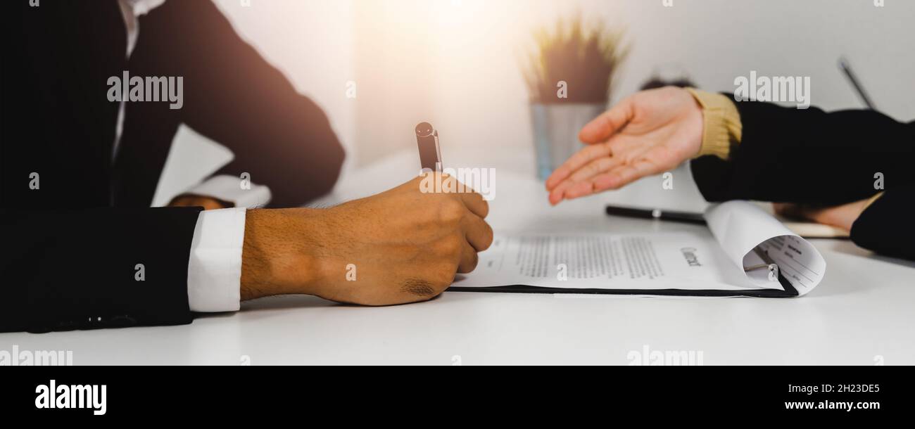 Close up hand sign, Bank agency explain and employee signing contract ...