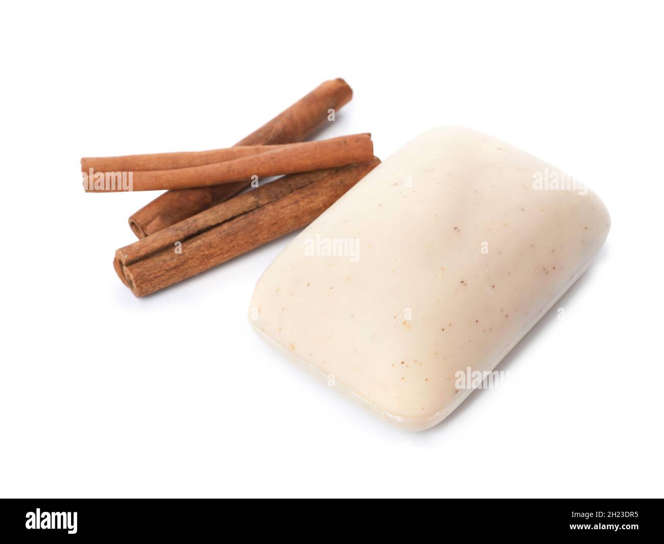 Soap bar and cinnamon sticks on white background Stock Photo - Alamy
