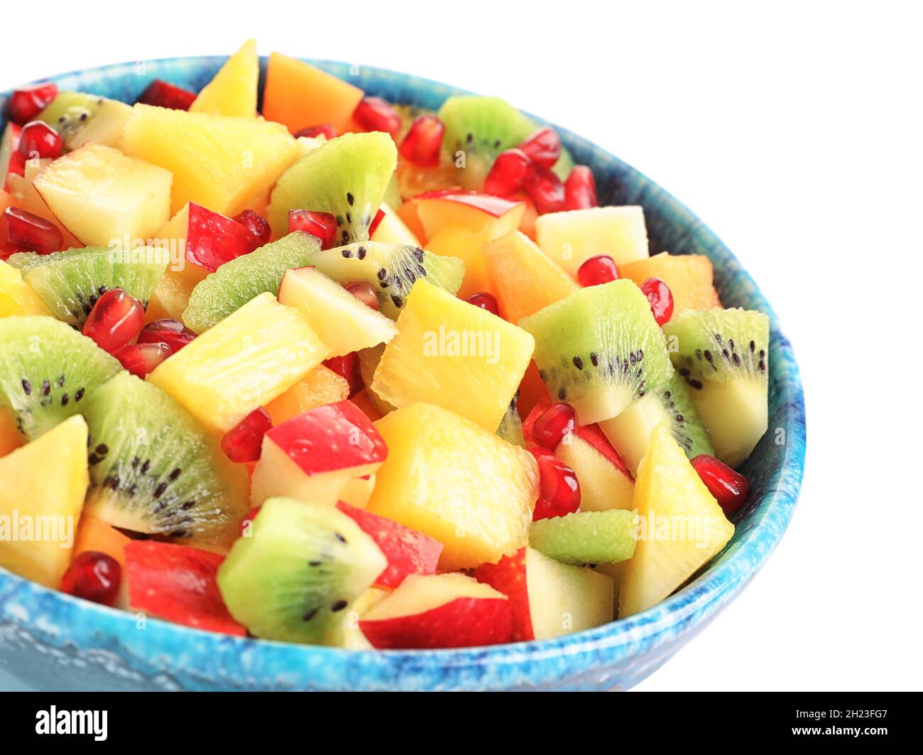 Bowl with fresh cut fruits on white background Stock Photo - Alamy