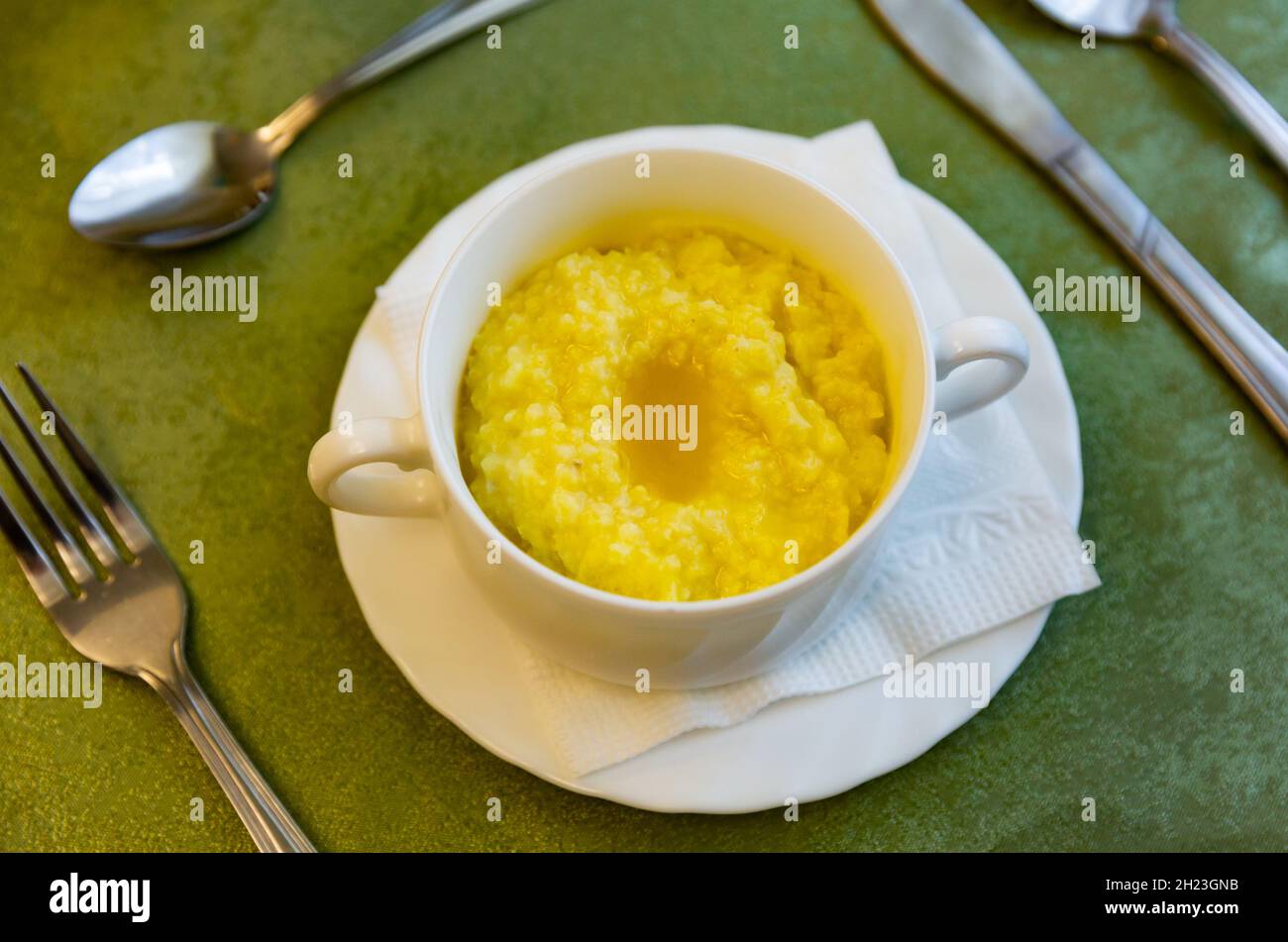 Millet porridge in bowl at eatery, Russian cuisine Stock Photo - Alamy