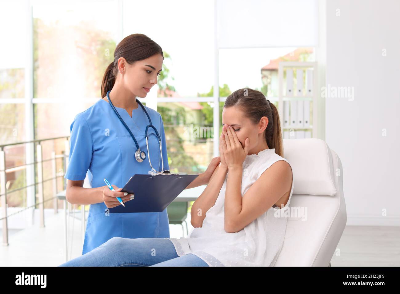 Patient having appointment with doctor in hospital Stock Photo - Alamy