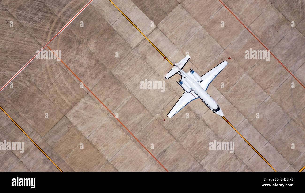 Parked expensive private airplane on concrete ground of airport, aerial ...
