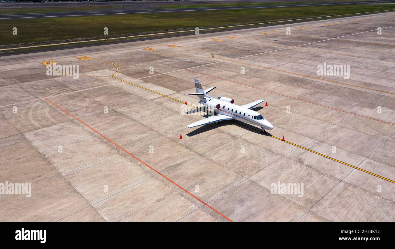 Parked expensive private airplane on concrete ground of airport, aerial ...
