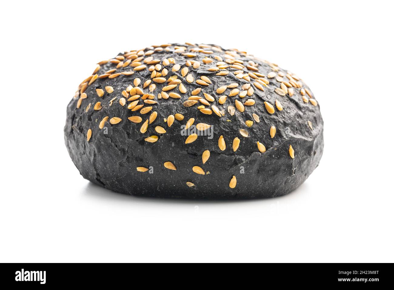 Black bun. Dark pastry with sesame seeds isolated on white background ...