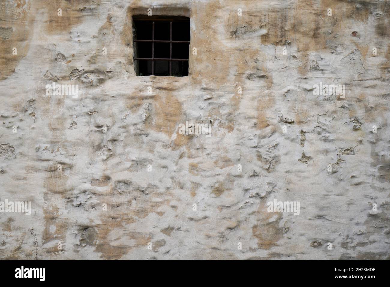 Single window on a weathered rough wall building Stock Photo - Alamy
