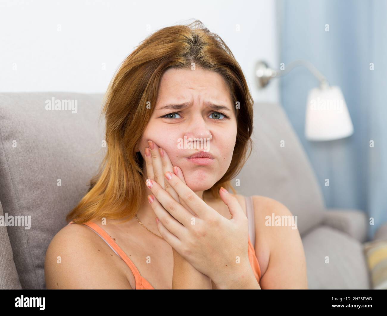 Sick girl have strong pain in tooth Stock Photo - Alamy