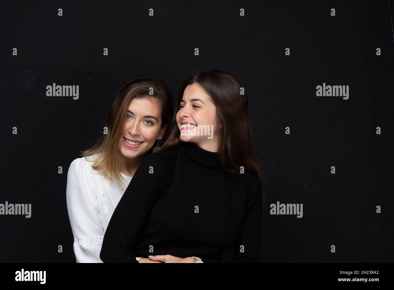 Portrait of two happy women friends with loving gestures laughing on a ...