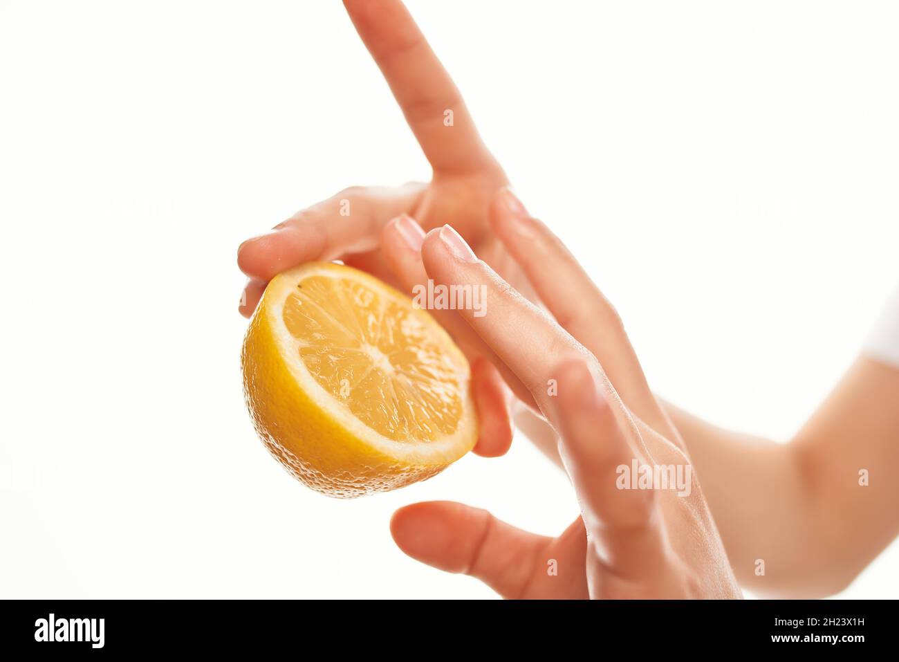 lemon in hand ingredients cooking health fruit Stock Photo - Alamy