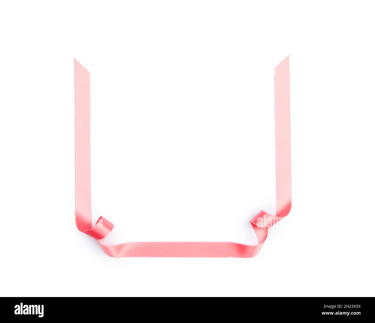 Pink streamer ribbon on white background Stock Photo - Alamy