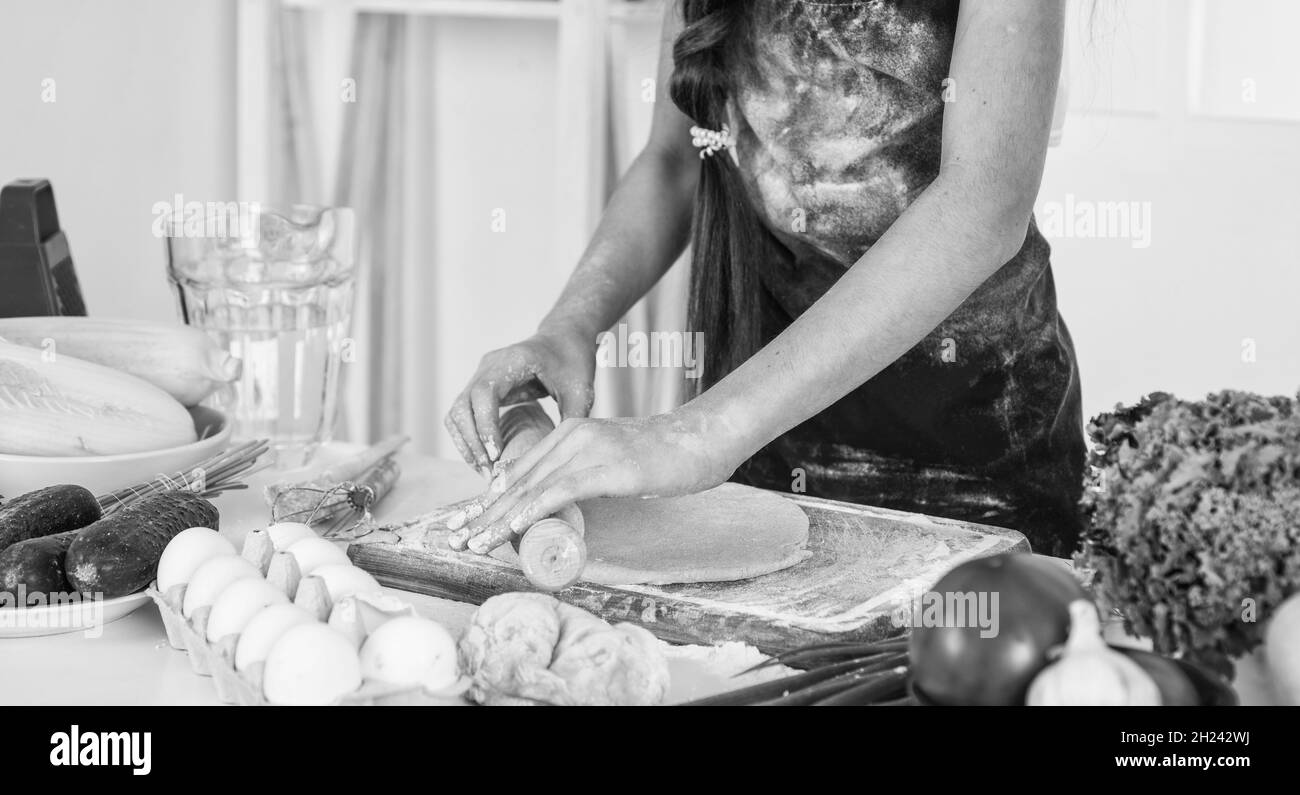 teen girl in cook uniform prepare food in kitchen, culinary Stock Photo ...