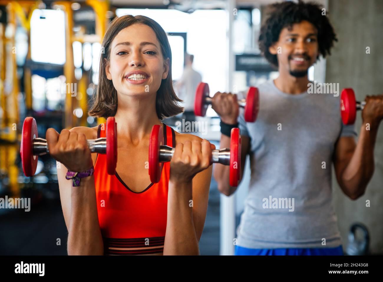 Happy diverse people exercise together in gym to stay healthy Stock ...