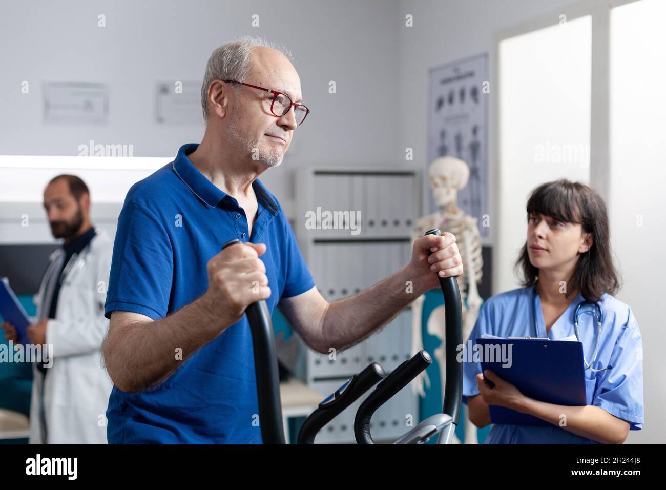 Senior man doing physical exercise for orthopedic recovery, receiving ...